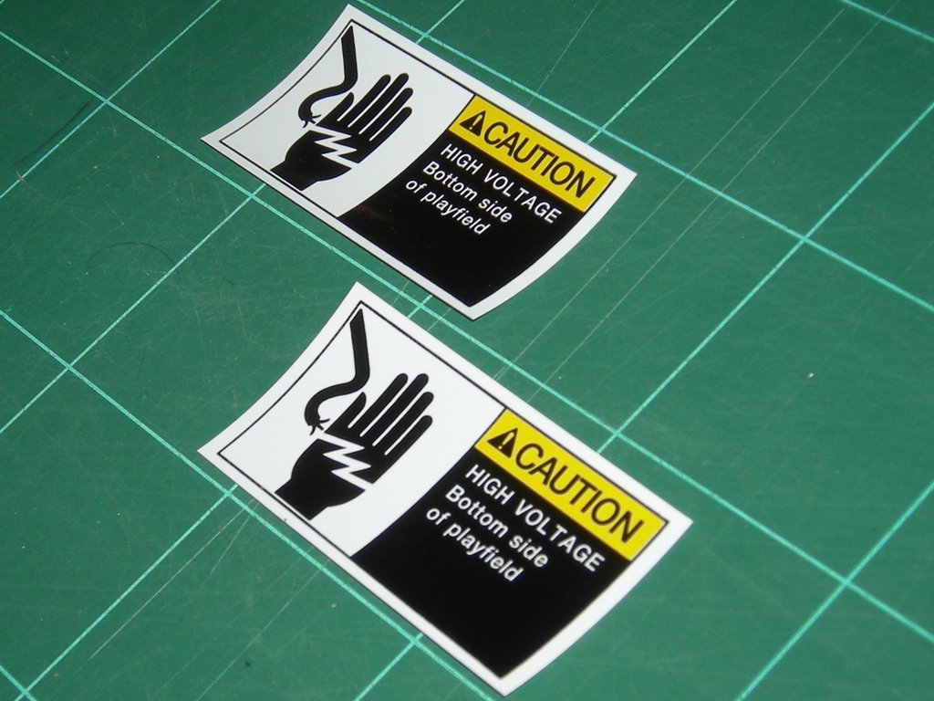 "HIGH VOLTAGE PLAYFIELD WARNING STICKER" escaneado a 600 dpi y ...