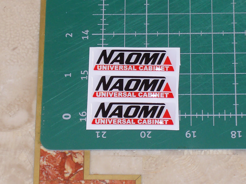 "Naomi Universal Cabinet logo / Emblem NOA-1507" (SEGA) printed on ...